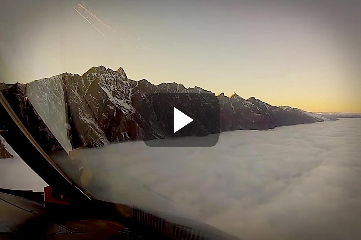 Fly A Curved Approach Through Clouds And Mountains In New Zealand ...